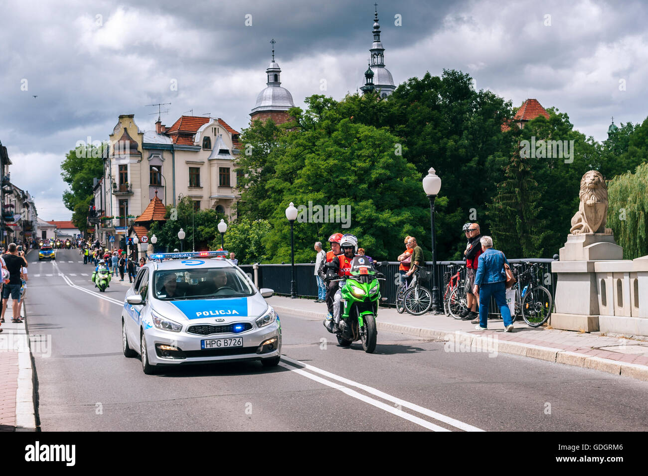 Polish police convoy on a bridge with a view of the old town towers in ...