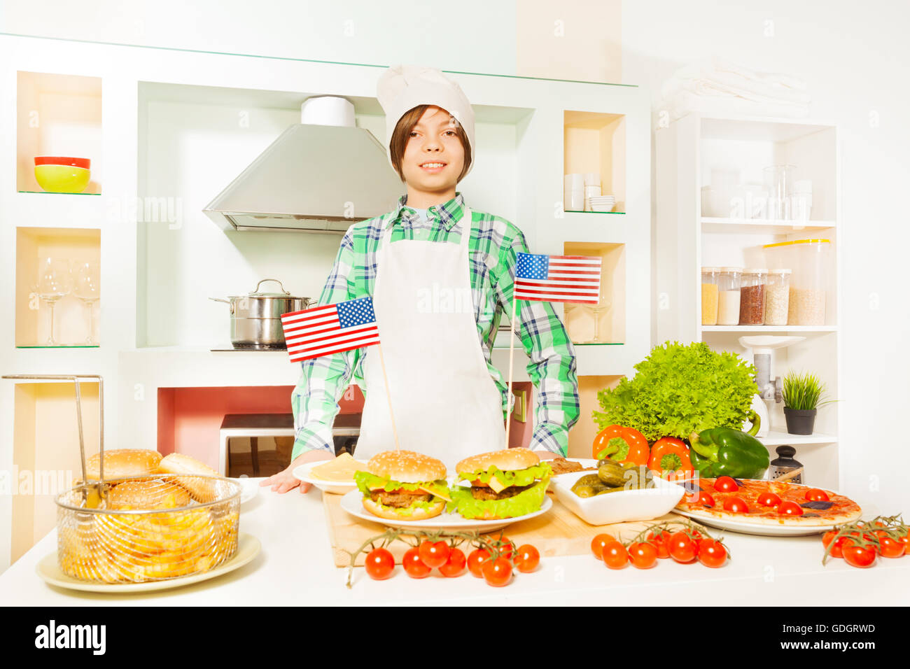 Young cook preparing traditional American menu Stock Photo - Alamy