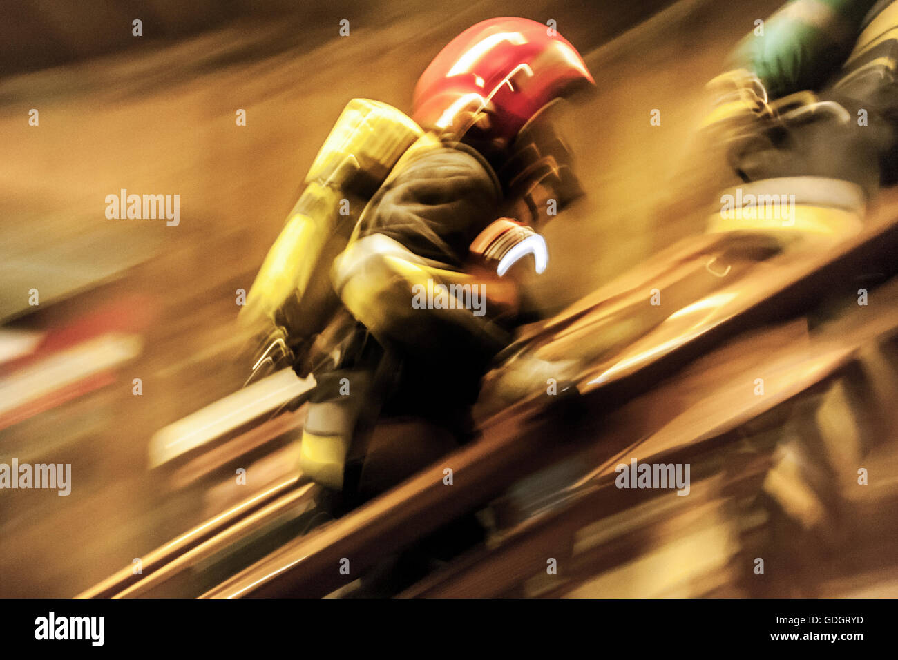 Two blurred Polish firemen running up the wooden stairs Stock Photo - Alamy