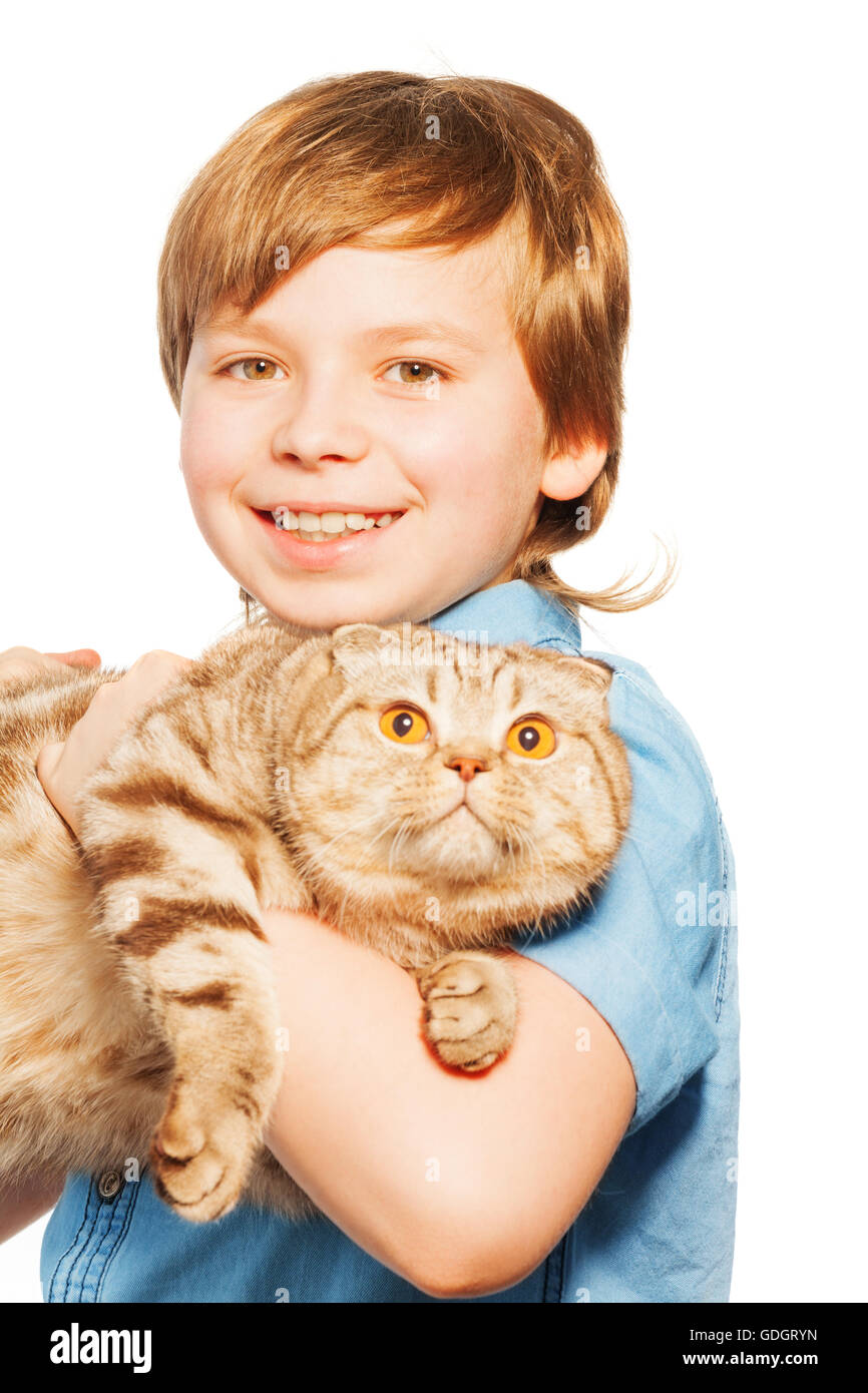 Portrait of smiling boy holding big cat Stock Photo - Alamy