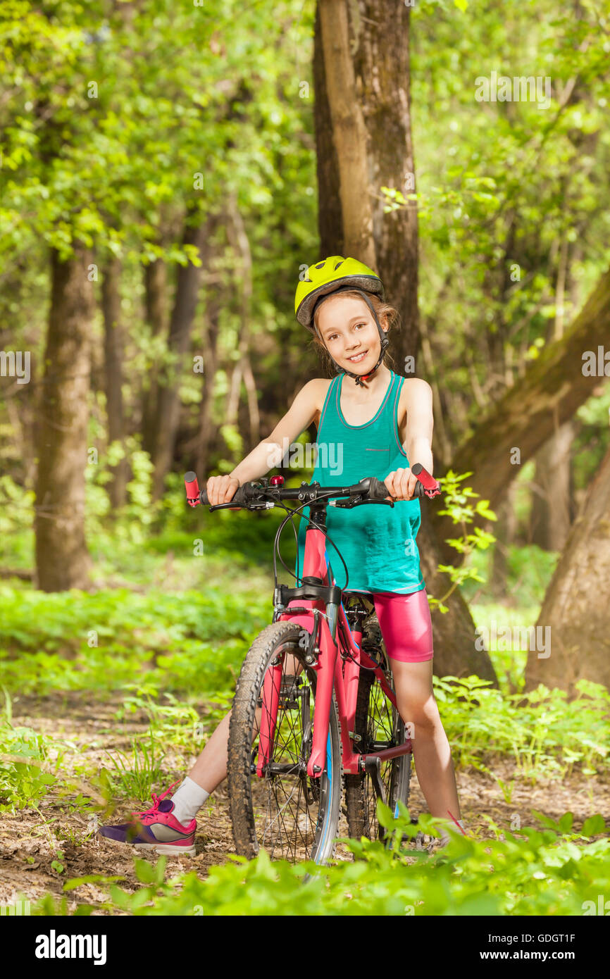 Girl cyclist relaxing sitting on her bike Stock Photo - Alamy