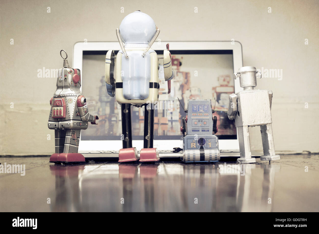 robots watch a film on a laptop Stock Photo - Alamy
