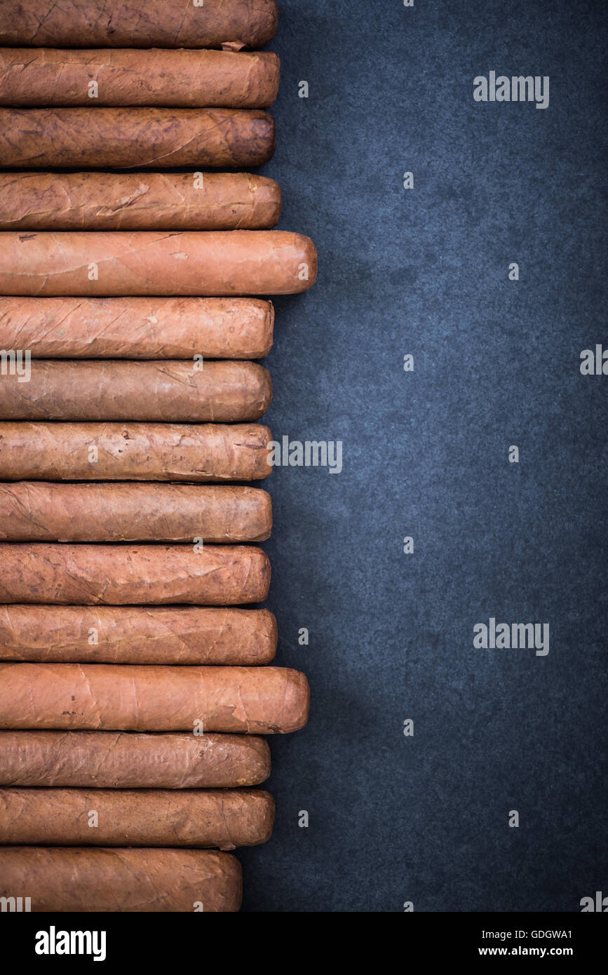 luxury cigars border background on dark slate Stock Photo - Alamy