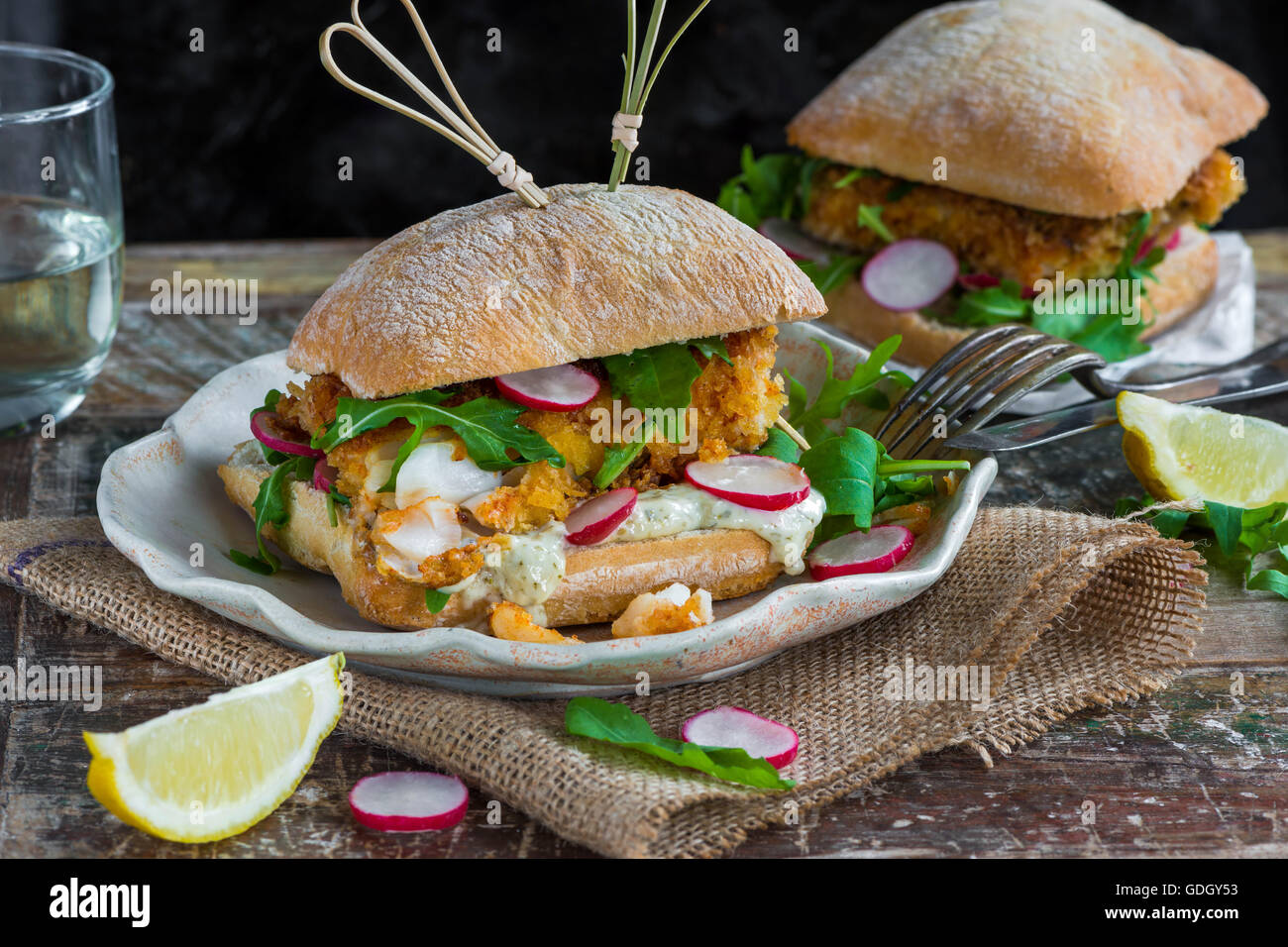 Crispy homemade fish burger or sandwich with salad Stock Photo - Alamy