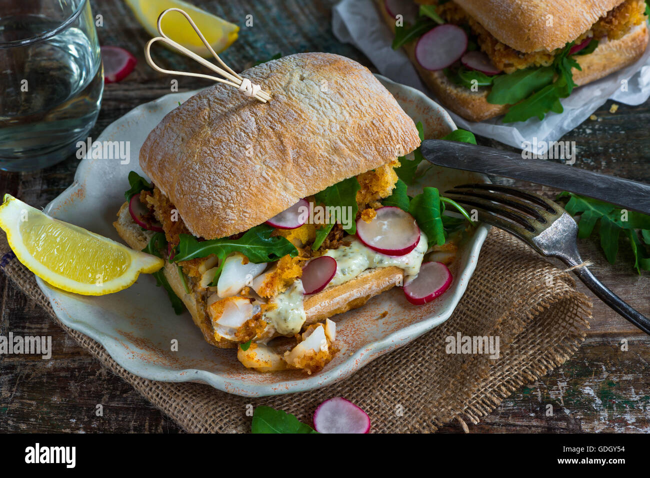 Crispy homemade fish burger or sandwich with salad Stock Photo - Alamy