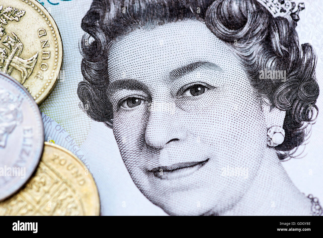 Pound note and coins Stock Photo - Alamy