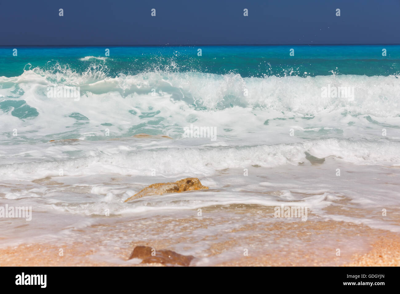 Tropical beach view, Greece, Lefkada. Detail of breaking waves on beach ...