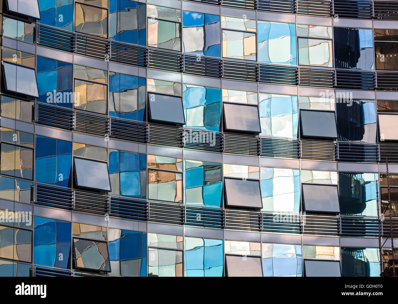 Reflection in the windows of modern glass office building Stock Photo ...