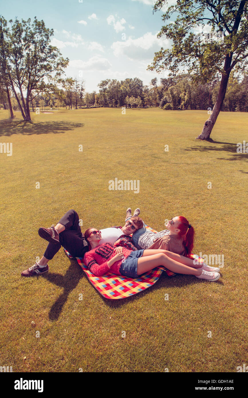 Best friends resting in park Stock Photo - Alamy
