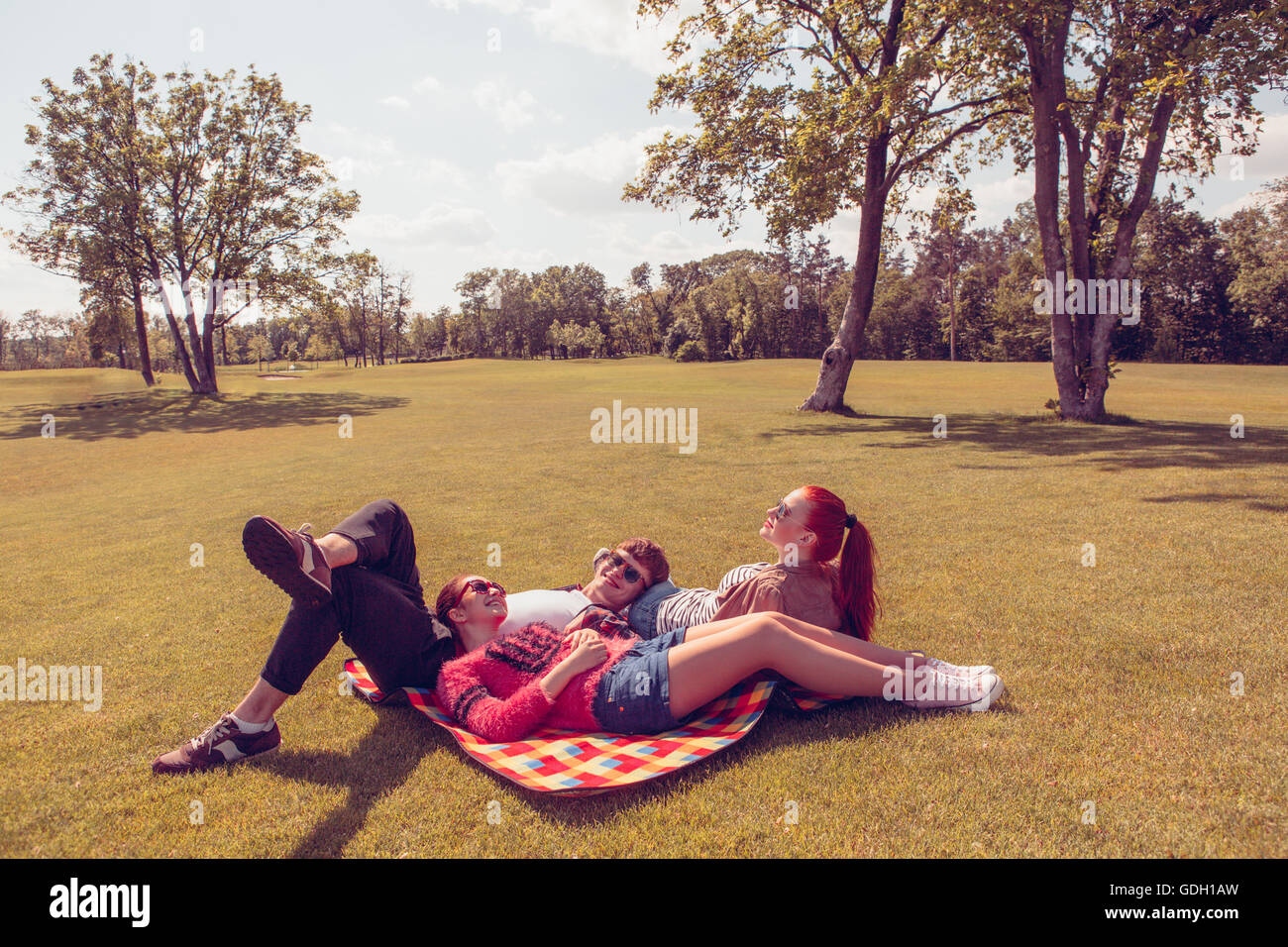 Best friends resting in park Stock Photo - Alamy