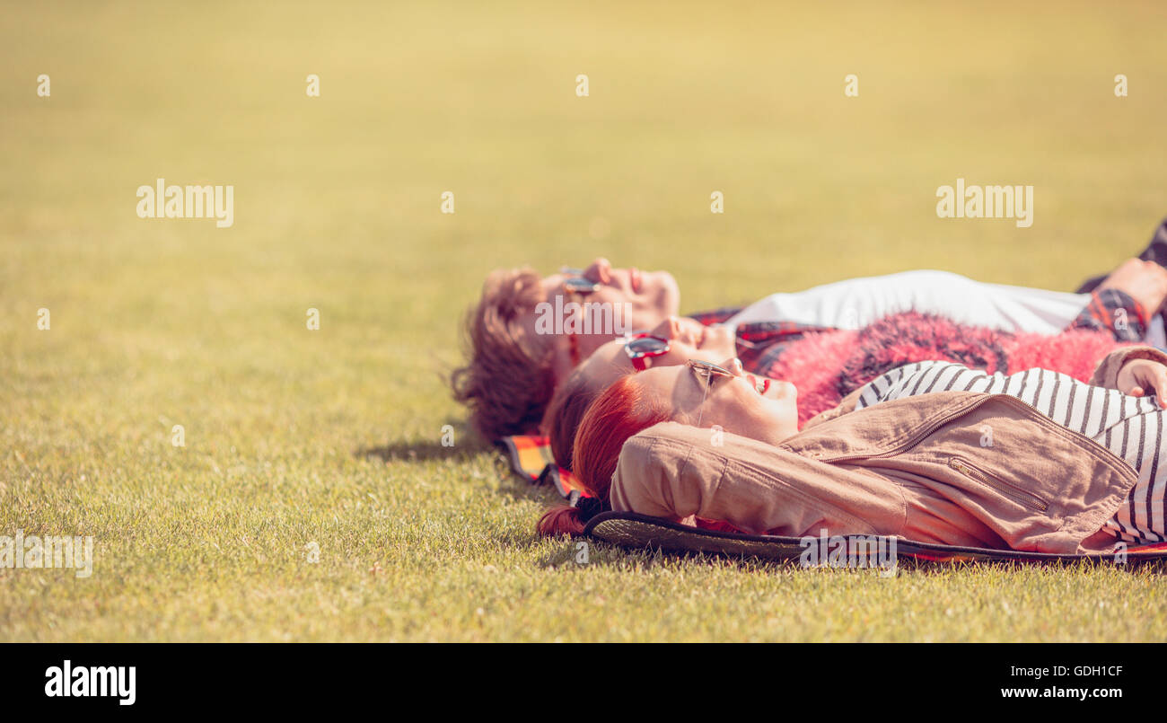 Best friends resting in park Stock Photo - Alamy