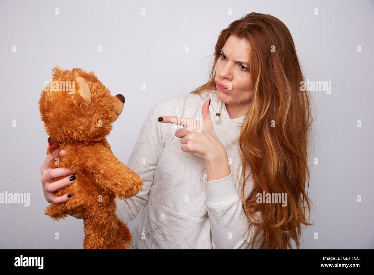 red-haired woman with a teddy bear Stock Photo - Alamy