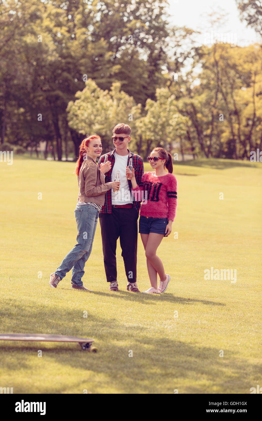Best friends resting in park Stock Photo - Alamy