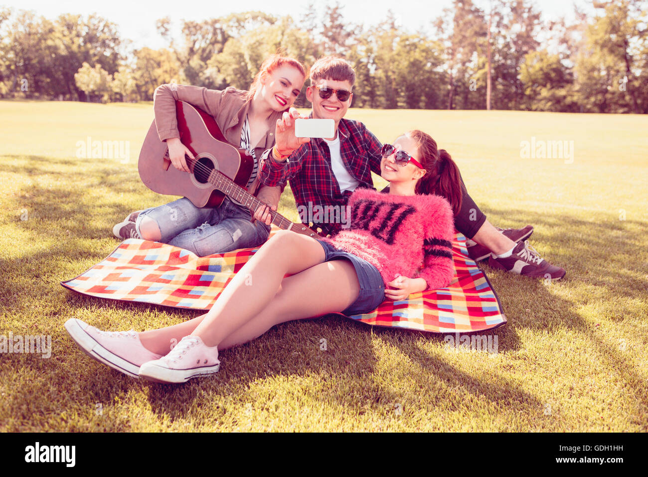 Best friends resting in park Stock Photo - Alamy