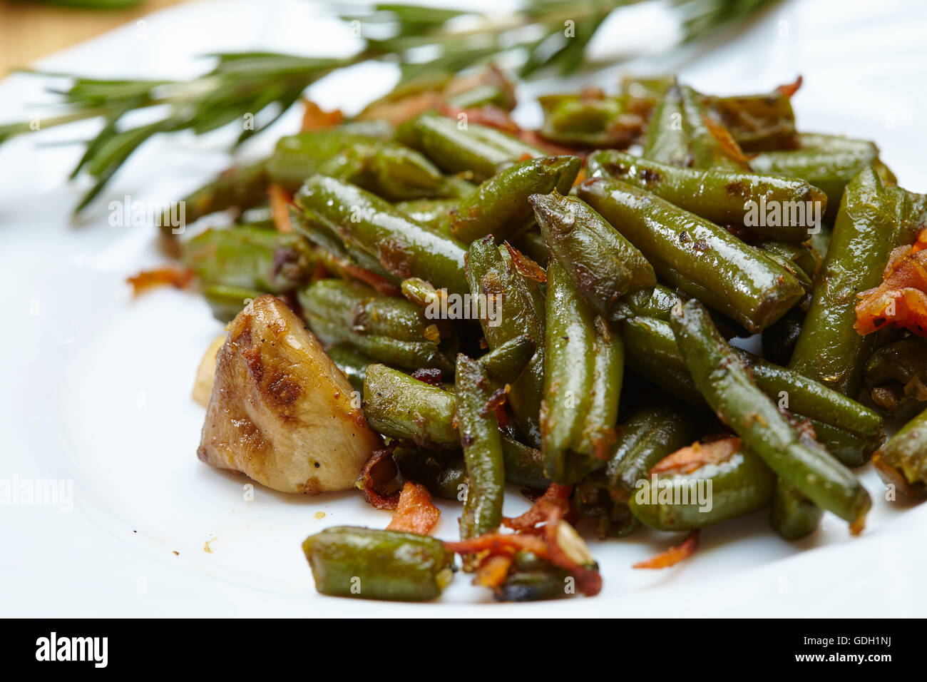 healthy vegan dish braised green beans Stock Photo - Alamy