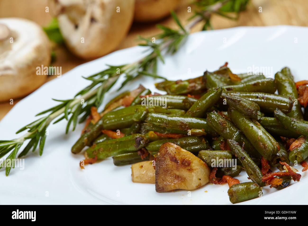 healthy vegan dish braised green beans Stock Photo - Alamy