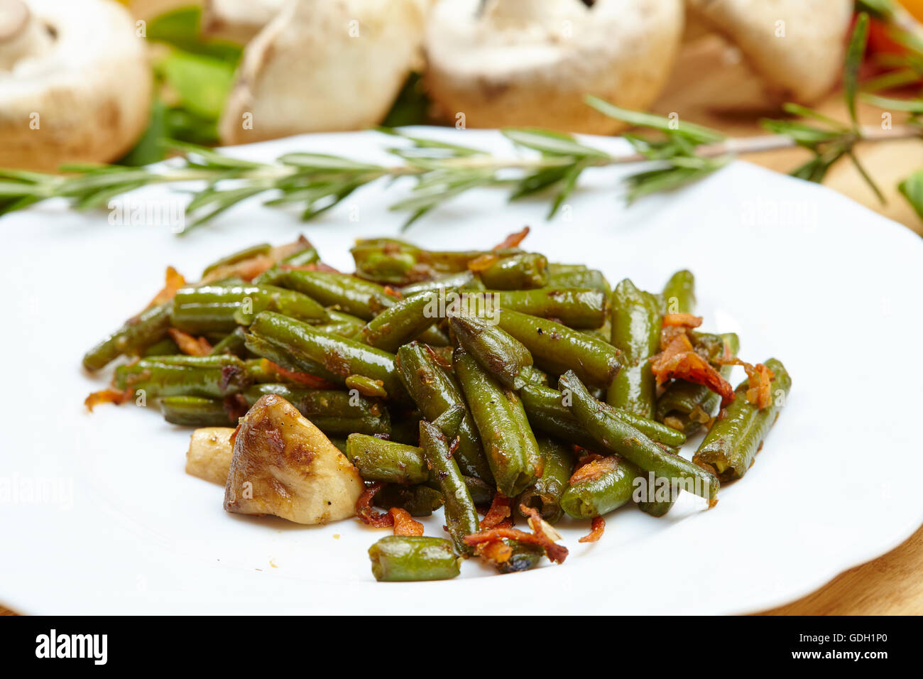 healthy vegan dish braised green beans Stock Photo - Alamy