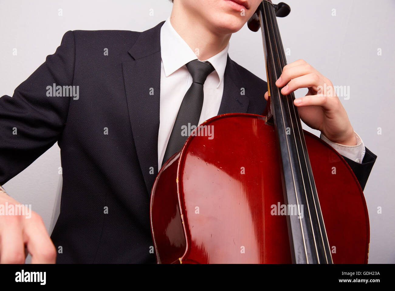 young man with a cello Stock Photo - Alamy