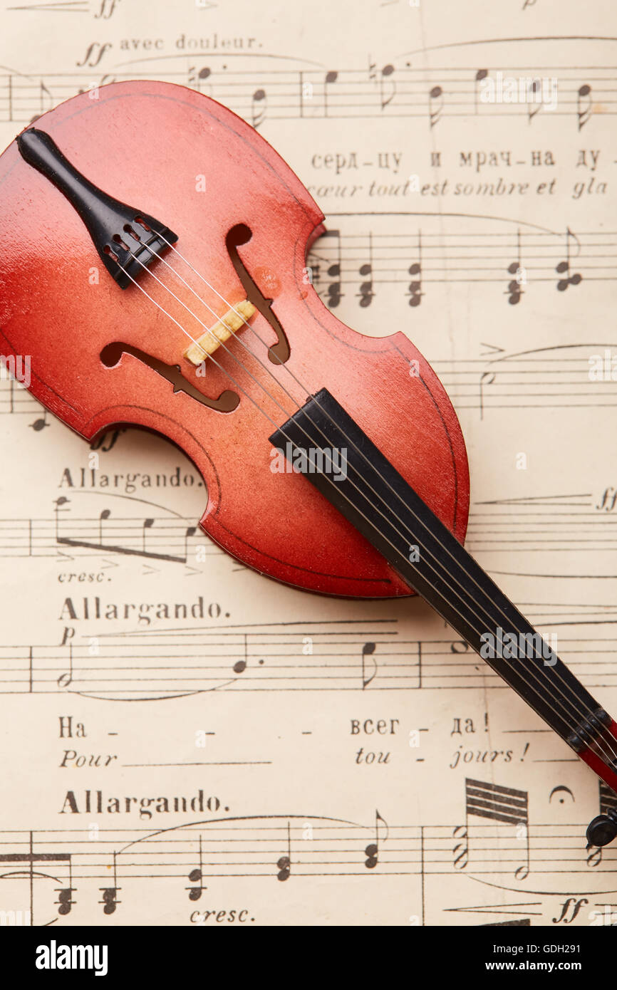 violoncello on of notes background Stock Photo - Alamy