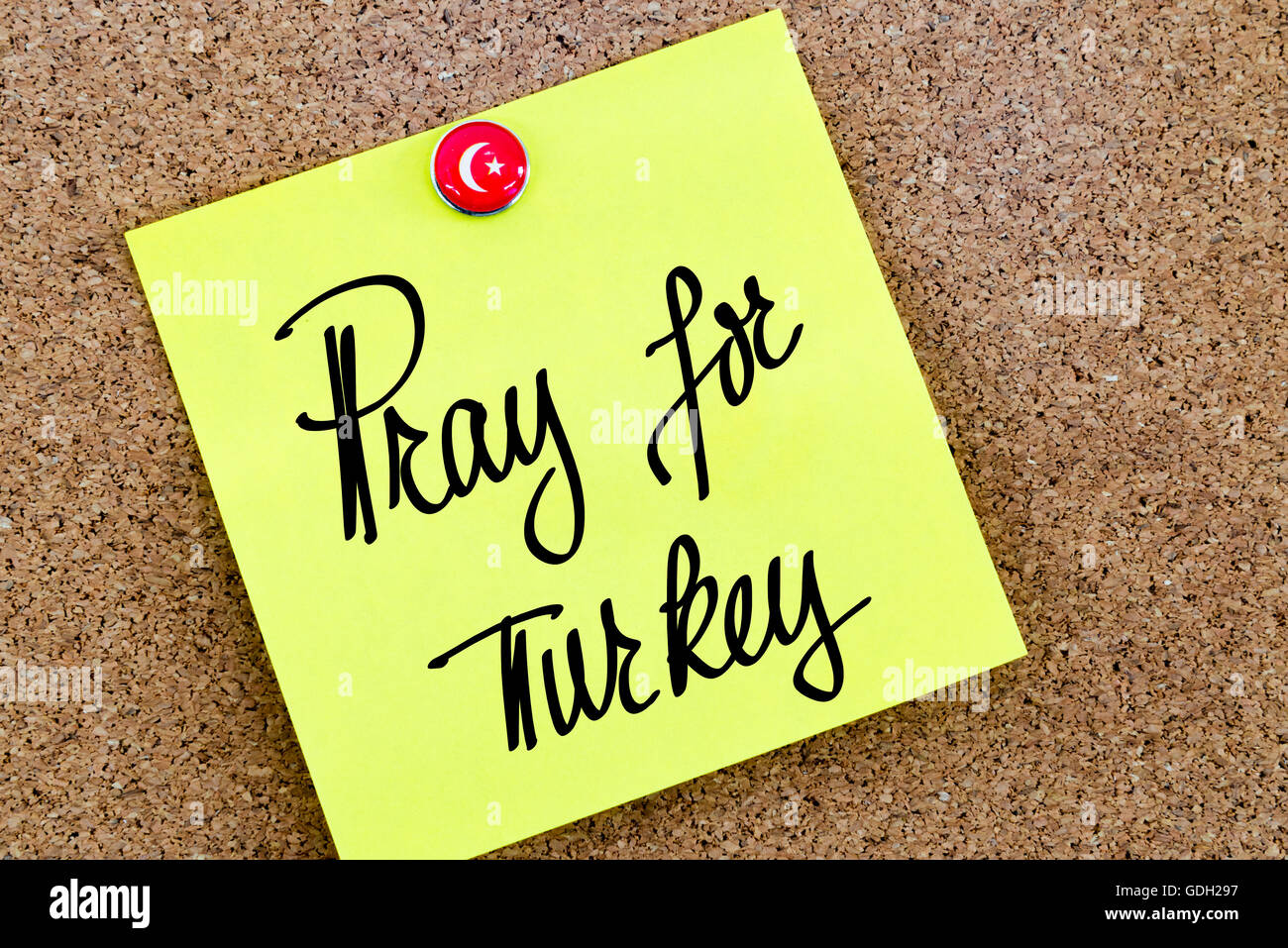 Written text Pray For Turkey over yellow paper note pinned on cork ...