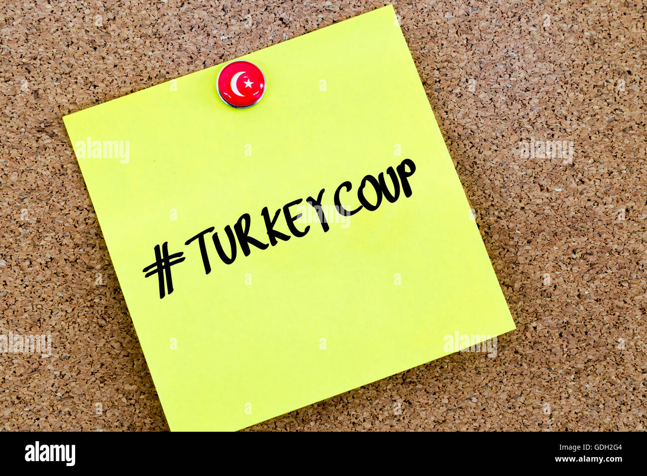 Written text Hastag Turkey Coup over yellow paper note pinned on cork ...