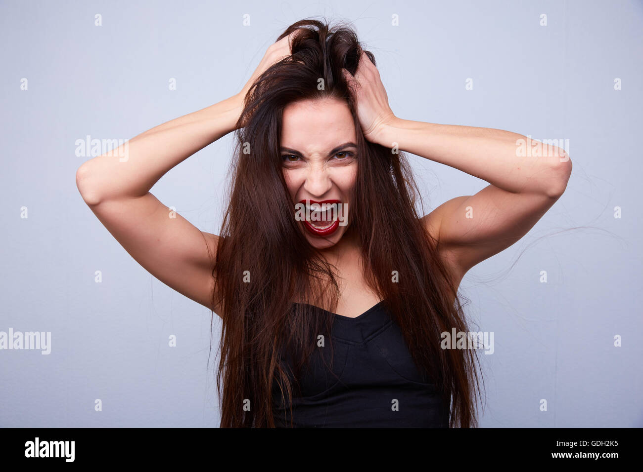 woman screaming and holding his head Stock Photo - Alamy