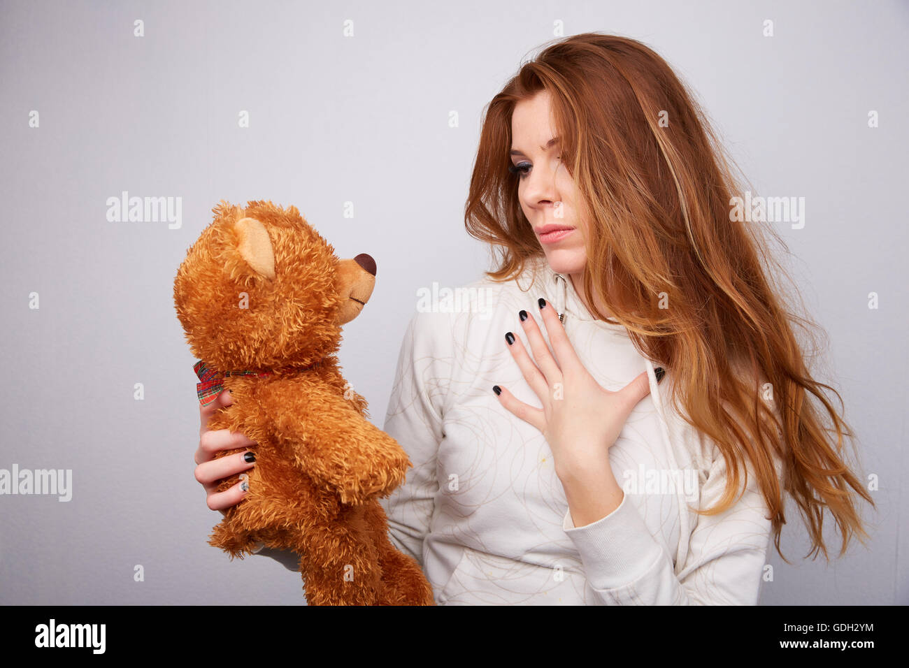 red-haired woman with a teddy bear Stock Photo - Alamy