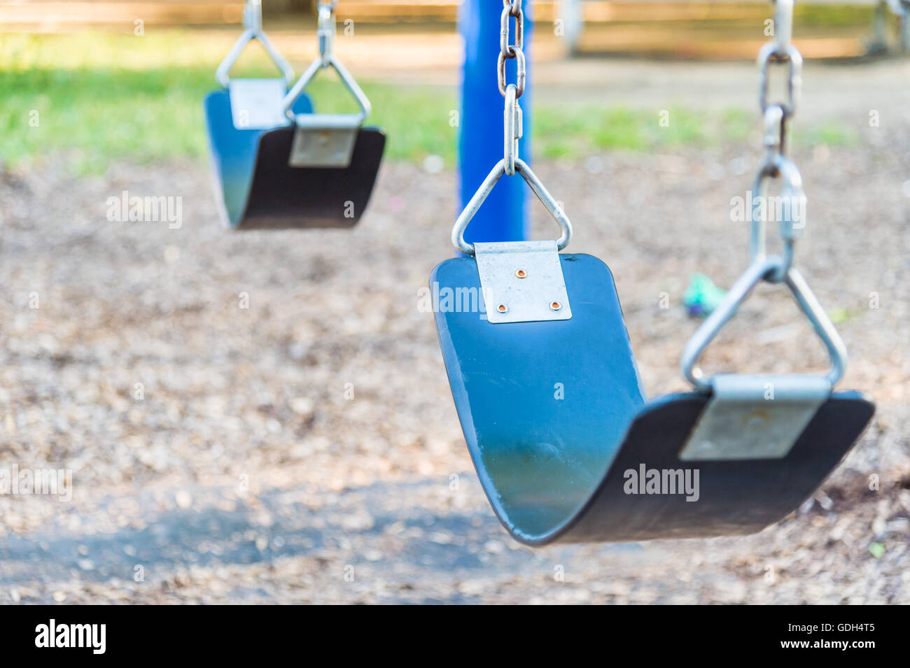 Empty playground blue swing set (selective focus Stock Photo - Alamy
