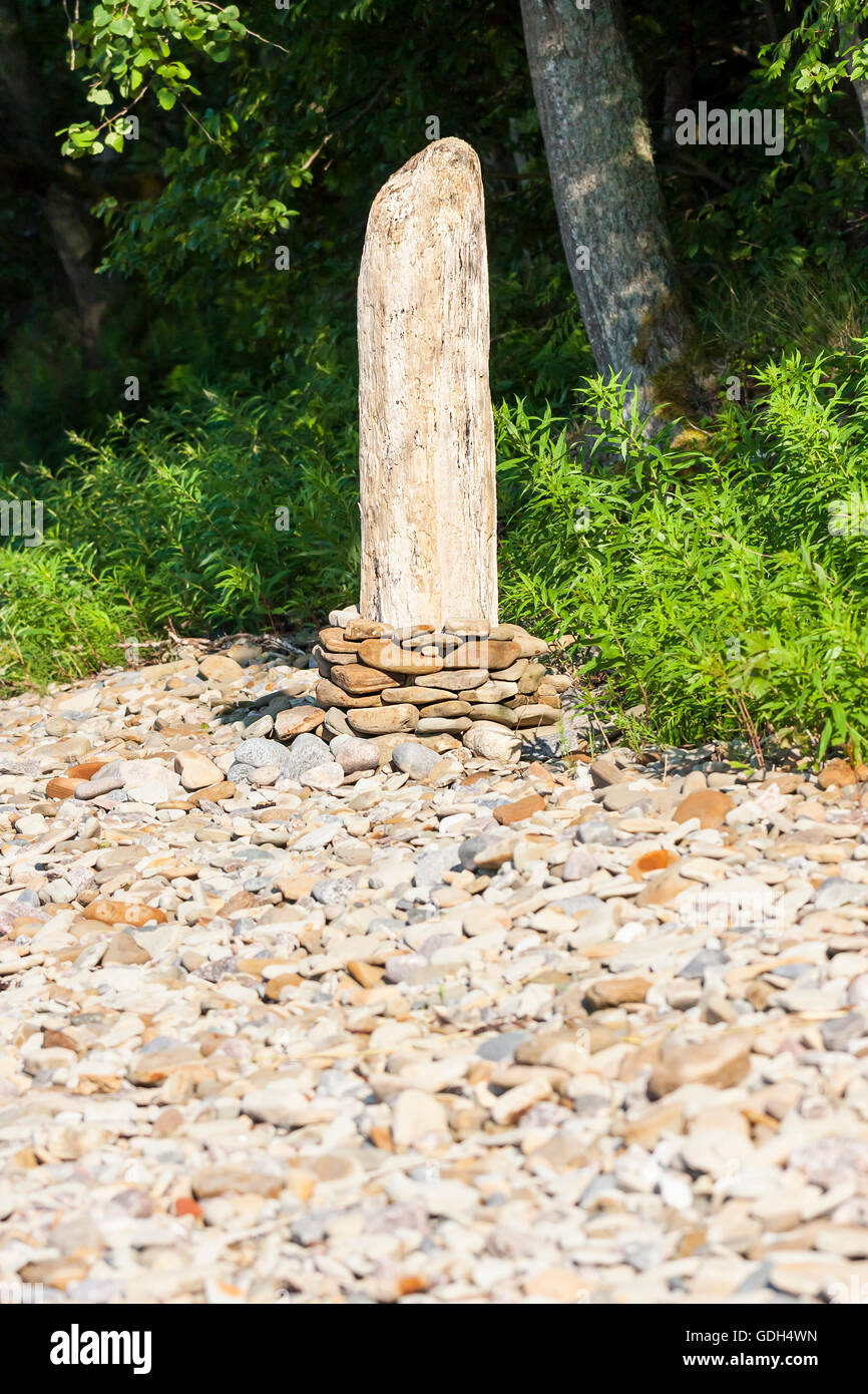 Old peeled tree stems placed on cobble stones Stock Photo - Alamy
