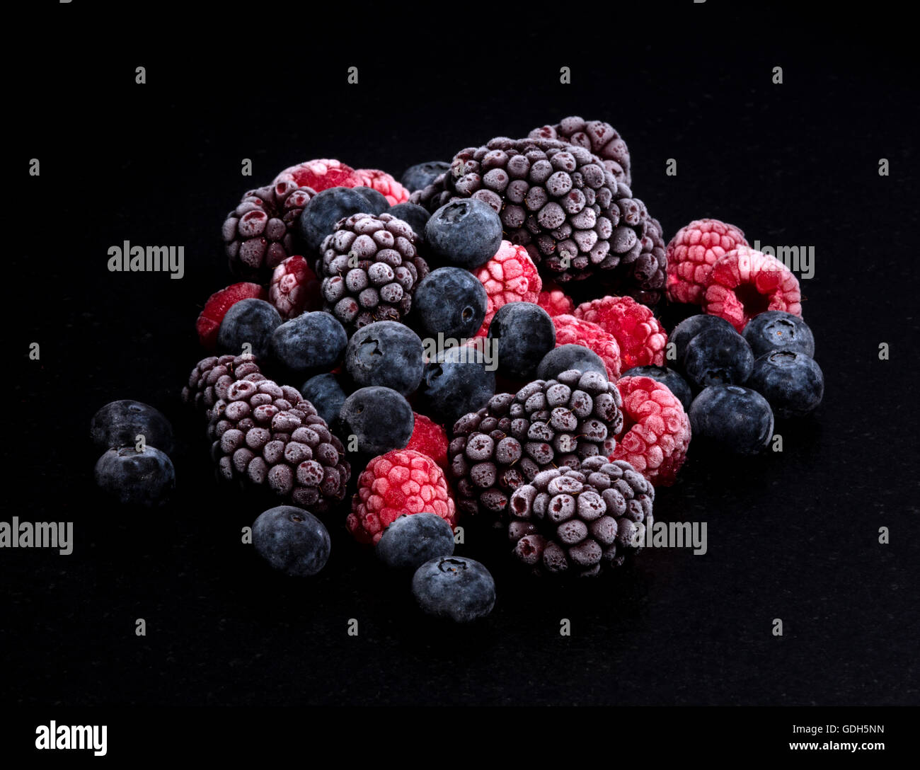 forest fruits frozen, raspberries, blueberries and blackberries on a ...