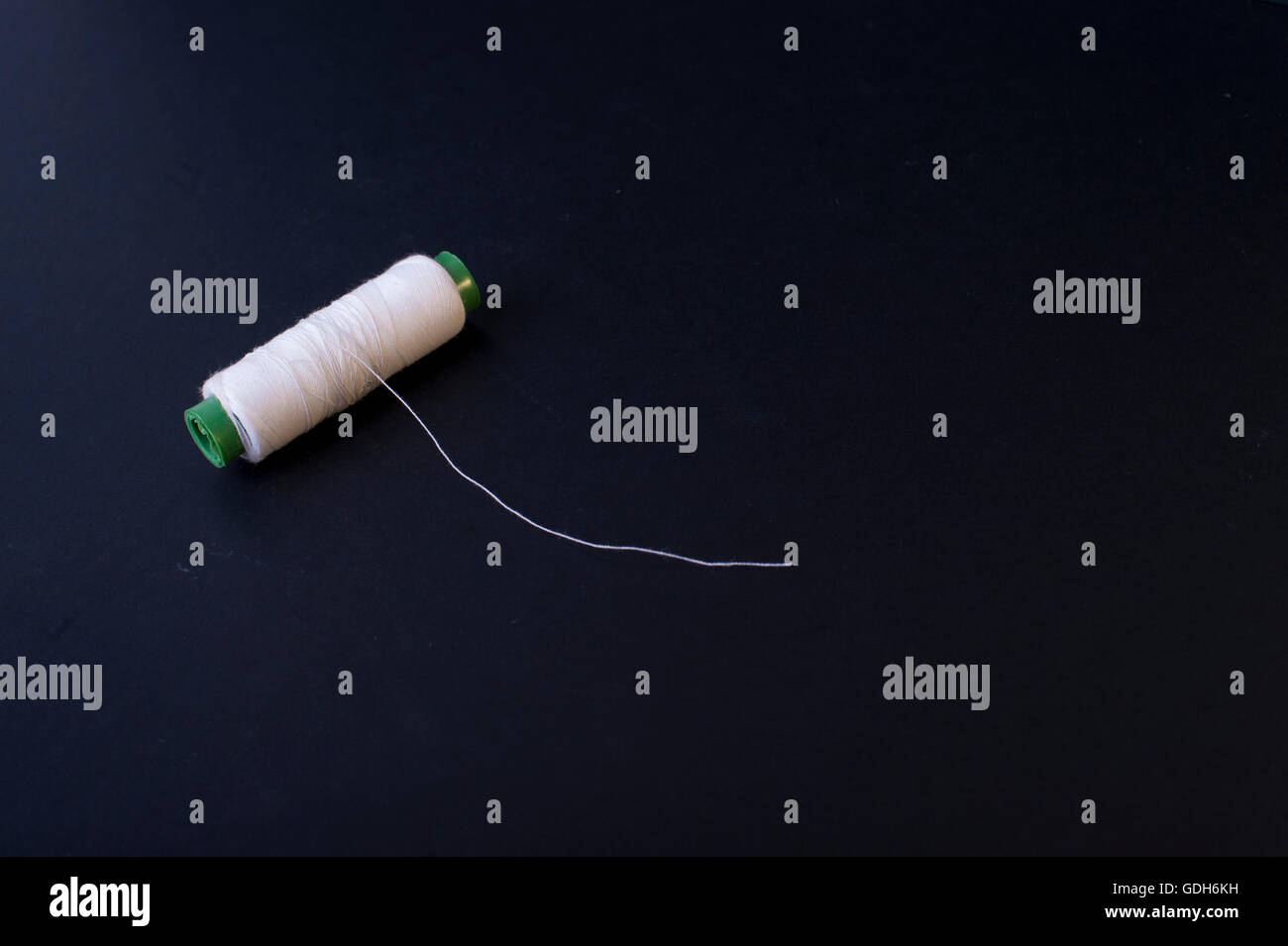 White thread on bobbin Stock Photo - Alamy