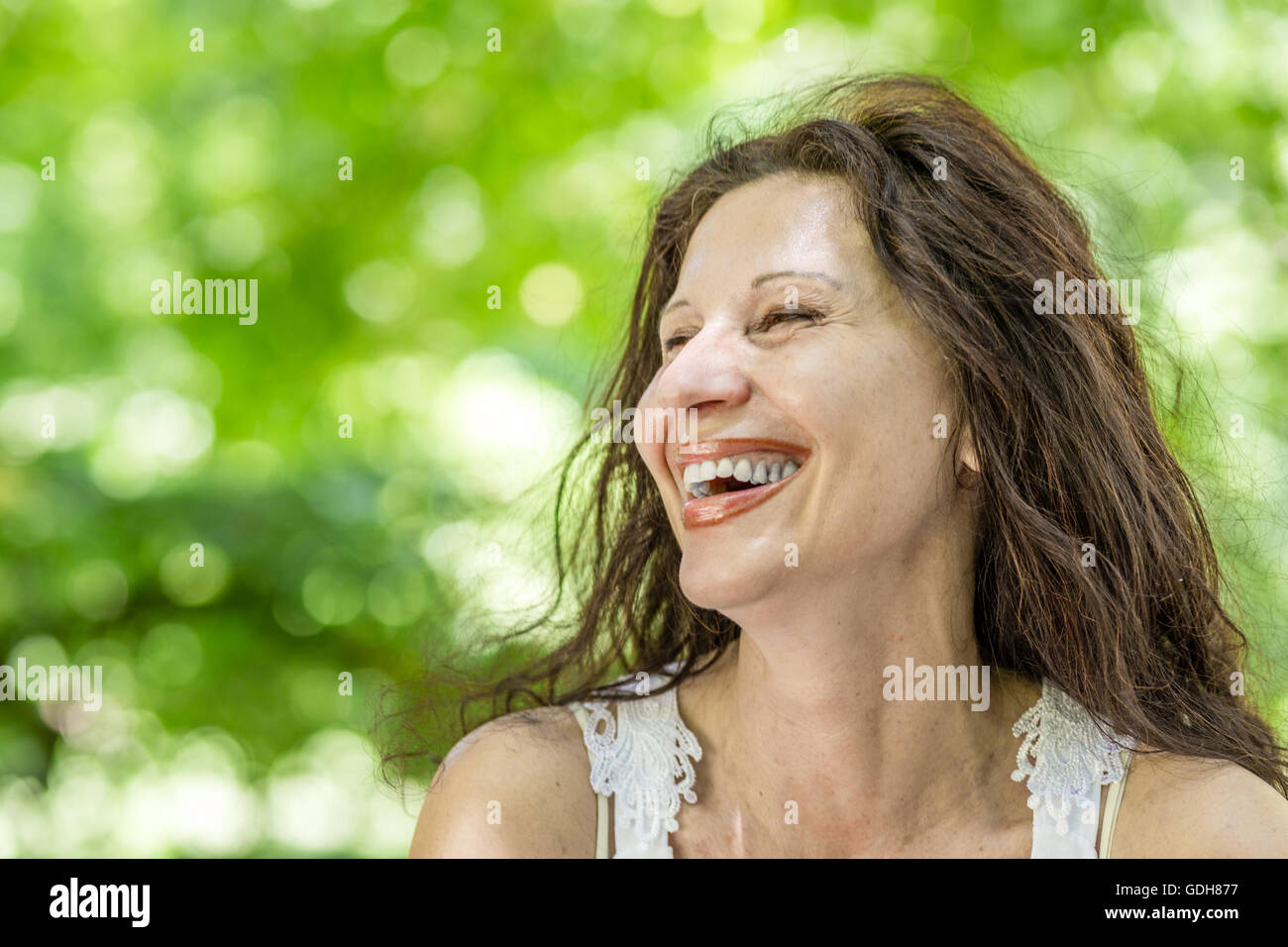 attractive woman laughs having fun Stock Photo - Alamy