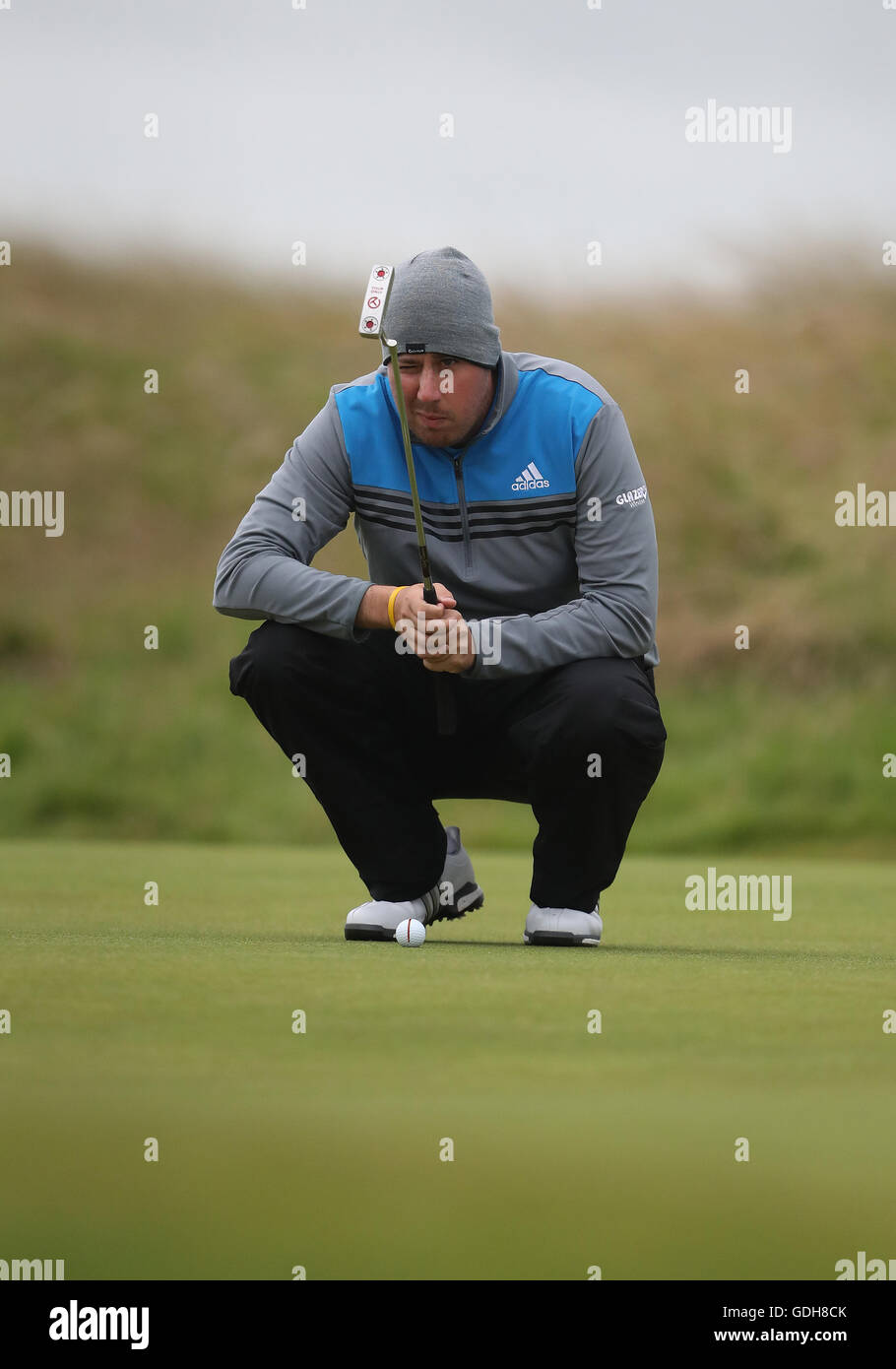 England's Ryan Evans lines up a putt during day four of The Open ...