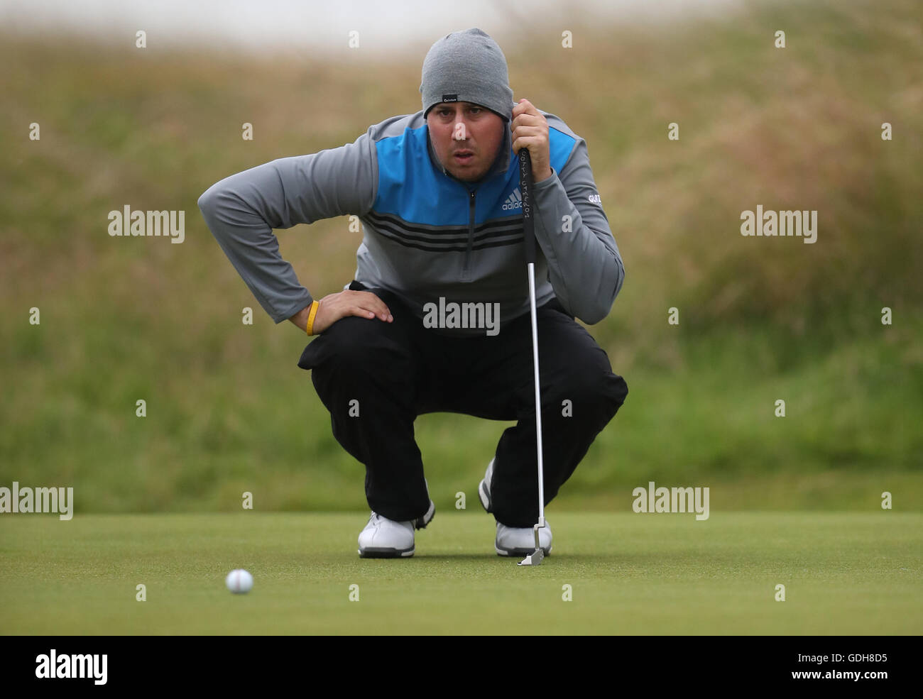 England's Ryan Evans lines up a putt during day four of The Open ...