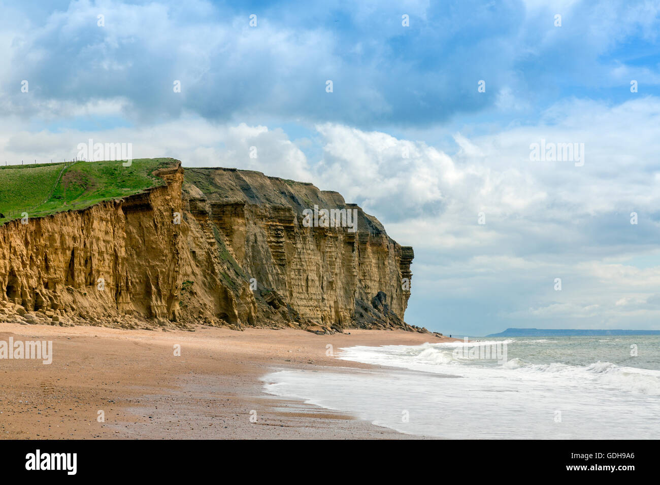 The sandstone strata of Burton Cliff near Burton Bradstock on the ...