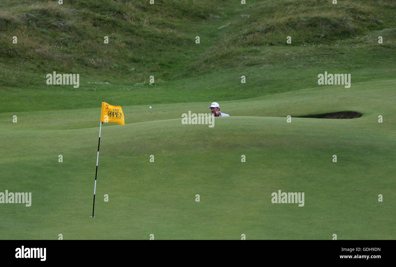 Northern Ireland's Graeme McDowell plays out of the bunker on the fifth ...