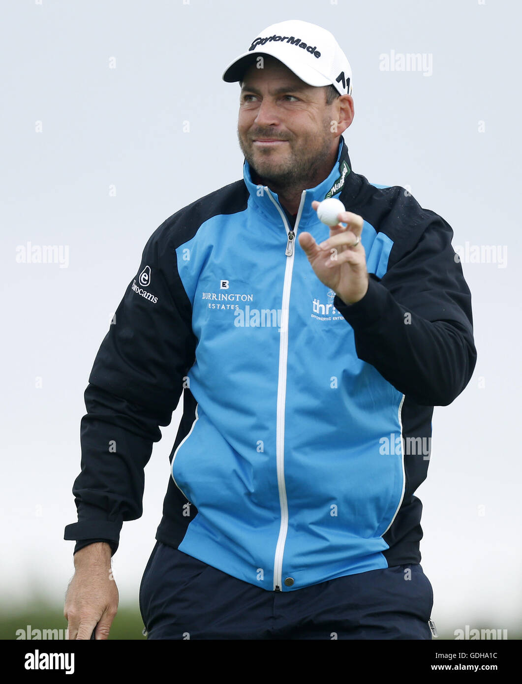 England's David Howell acknowledges the crowd on the first green during ...