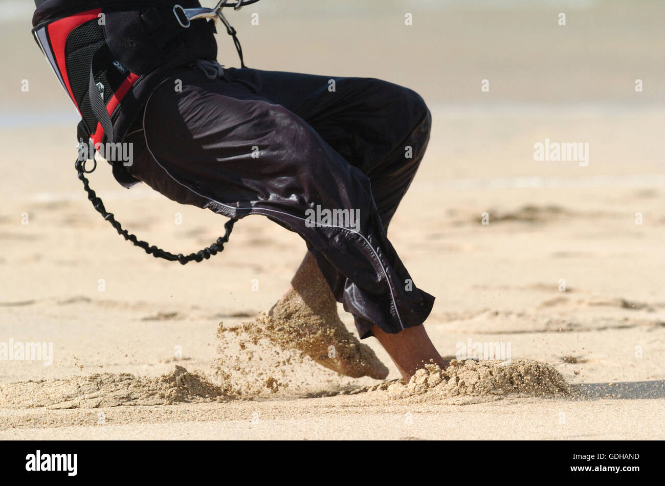 kite surfer bracing against the pull of the kite in the wind anchoring ...