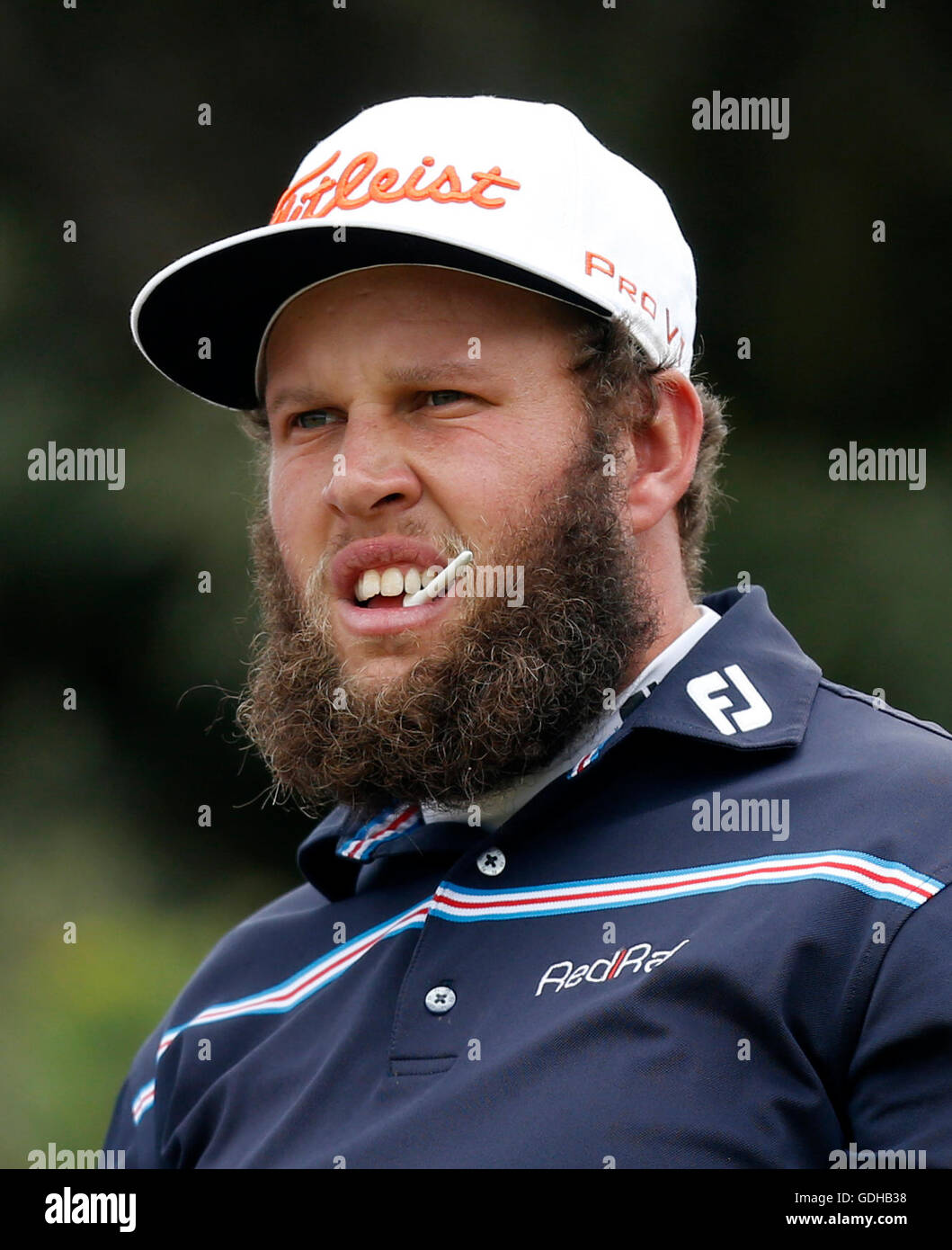England's Andrew Johnston ith a tee in his mouth on the 1st tee during ...