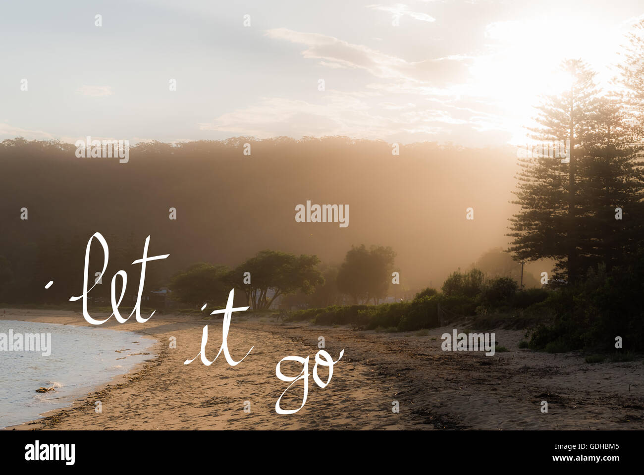 Let It Go message. Handwritten motivational text over sunset calm sunny ...
