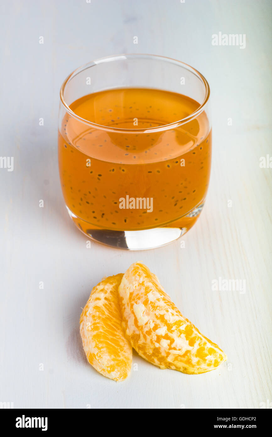 Glass of orange and basil seeds drink Stock Photo - Alamy