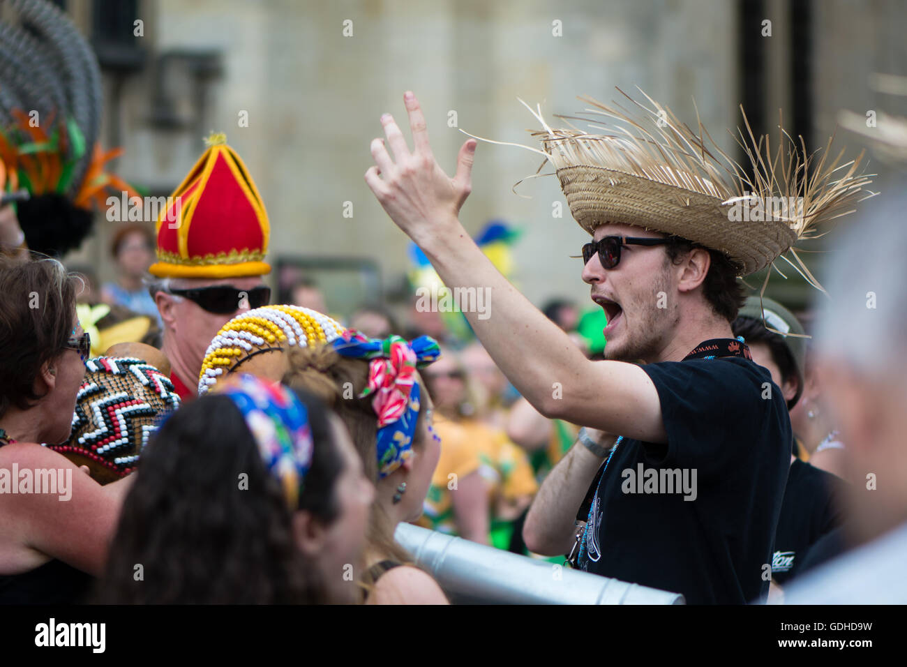 Man conducting drummers in straw hat. Bath Carnival procession ...