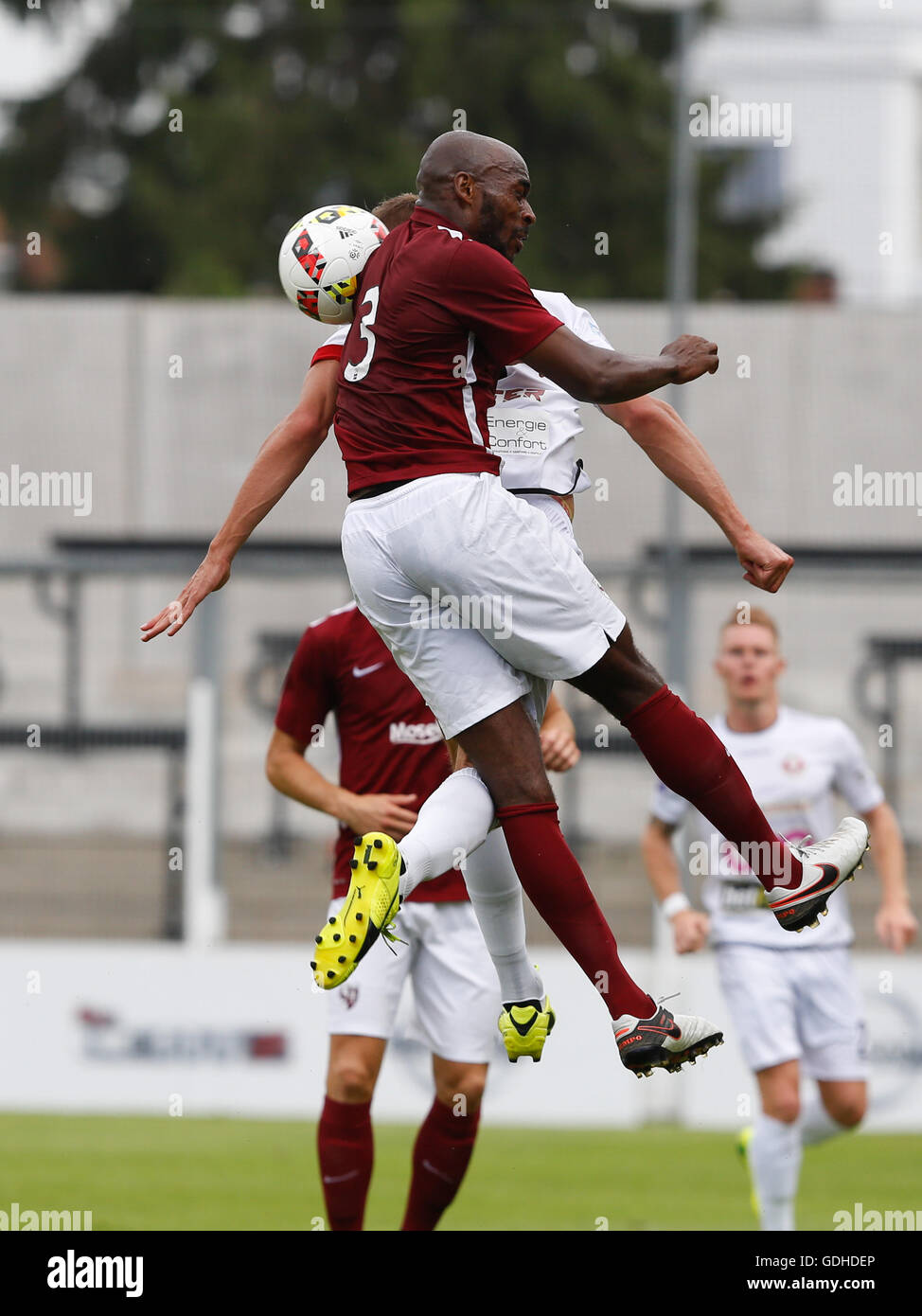 Seraing, Belgium. 16 Jul, 2016. FC Metz's RIVIEREZ (#3) jumps for a ...