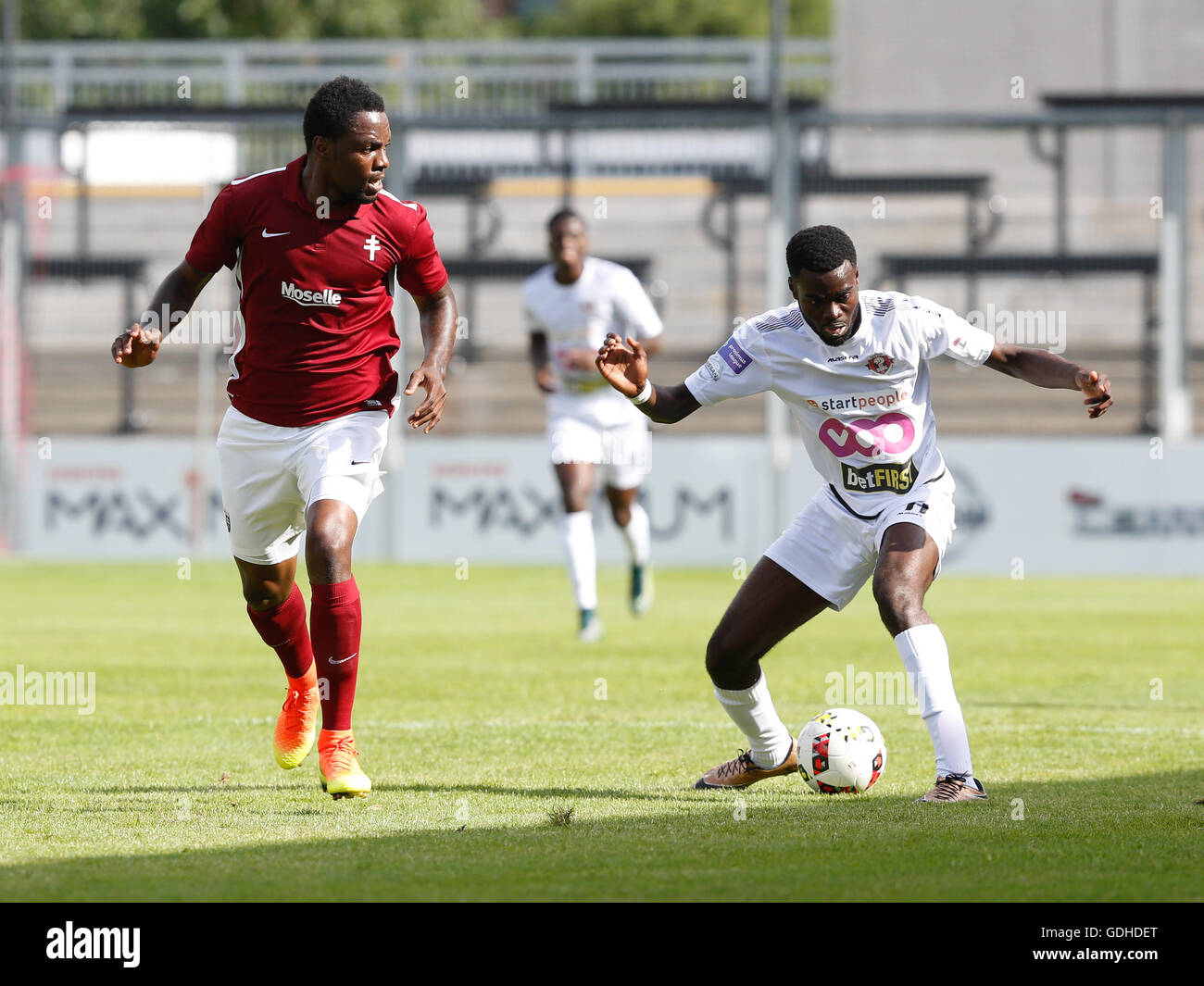 Seraing, Belgium. 16 Jul, 2016. Players compete for the ball during a ...