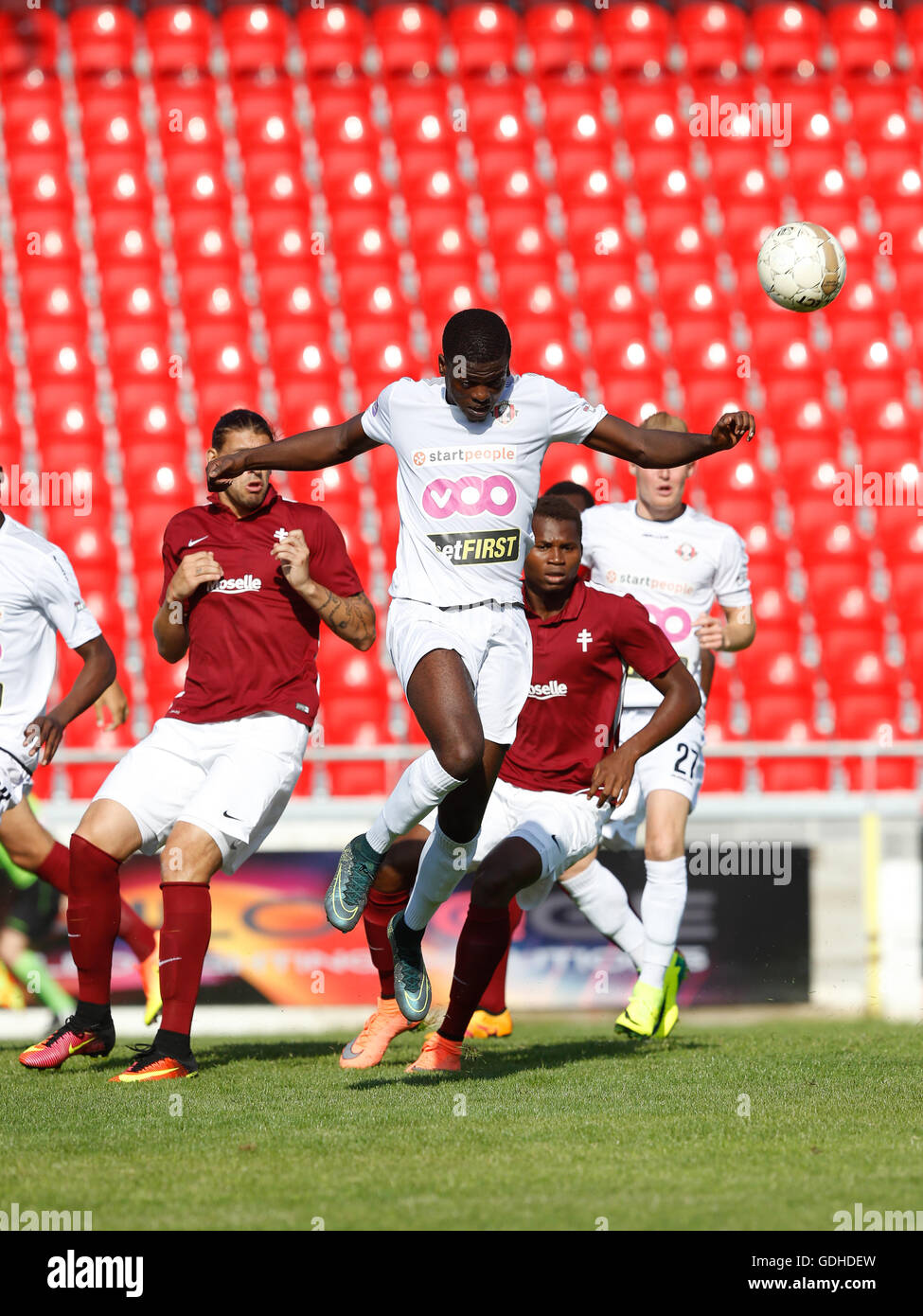 Seraing, Belgium. 16 Jul, 2016. Players compete for the ball during a ...