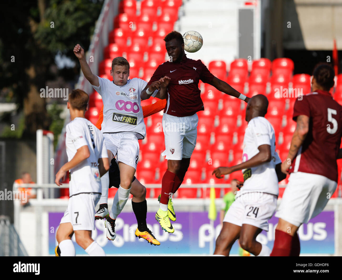 Seraing, Belgium. 16 Jul, 2016. Players compete for the ball during a ...