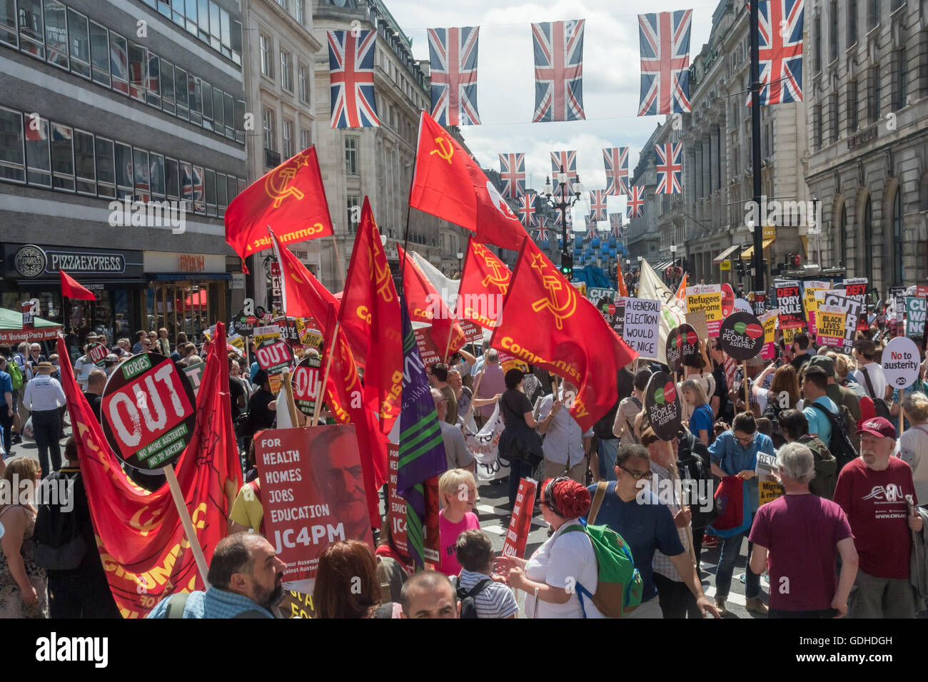 London, UK. 16th July 2016. Communist Party red flags and Union flags ...