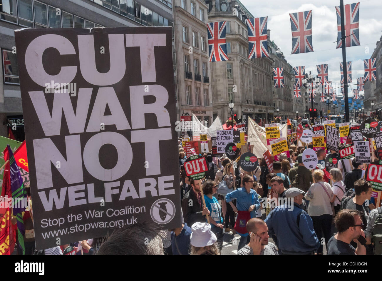 London, UK. 16th July 2016. A Stop the War placard 'Cut War NOT Welfare ...