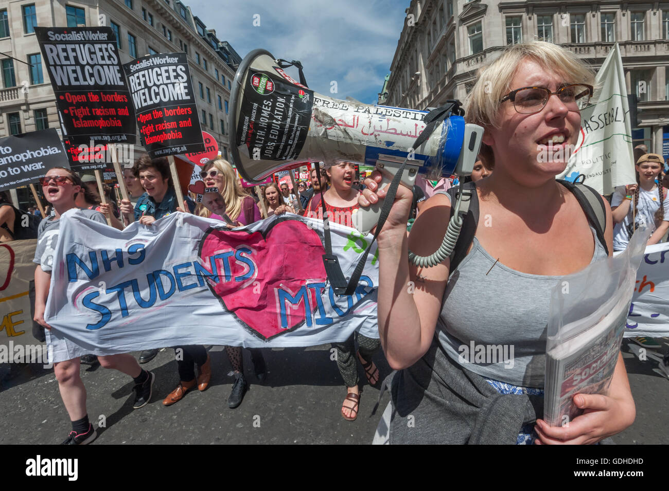 London, UK. 16th July 2016. A woman with a megaphone leads NHS Students ...