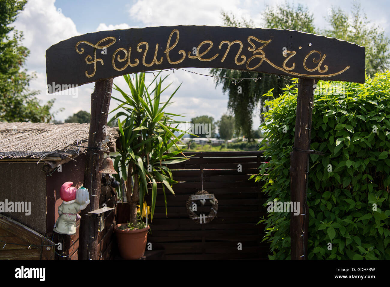 Rinteln, Germany. 12th July, 2016. A sign reading 'Faulenzia' hangs ...